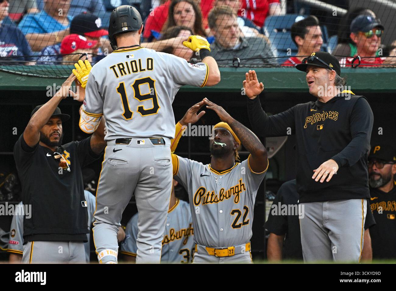 Pittsburgh Pirates' Jared Triolo (19) is greeted by teammates in the ...