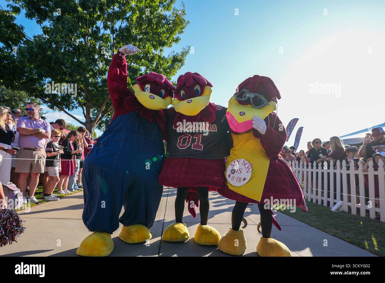 South Carolina mascot Cocky, center, poses with his "mother" and ...