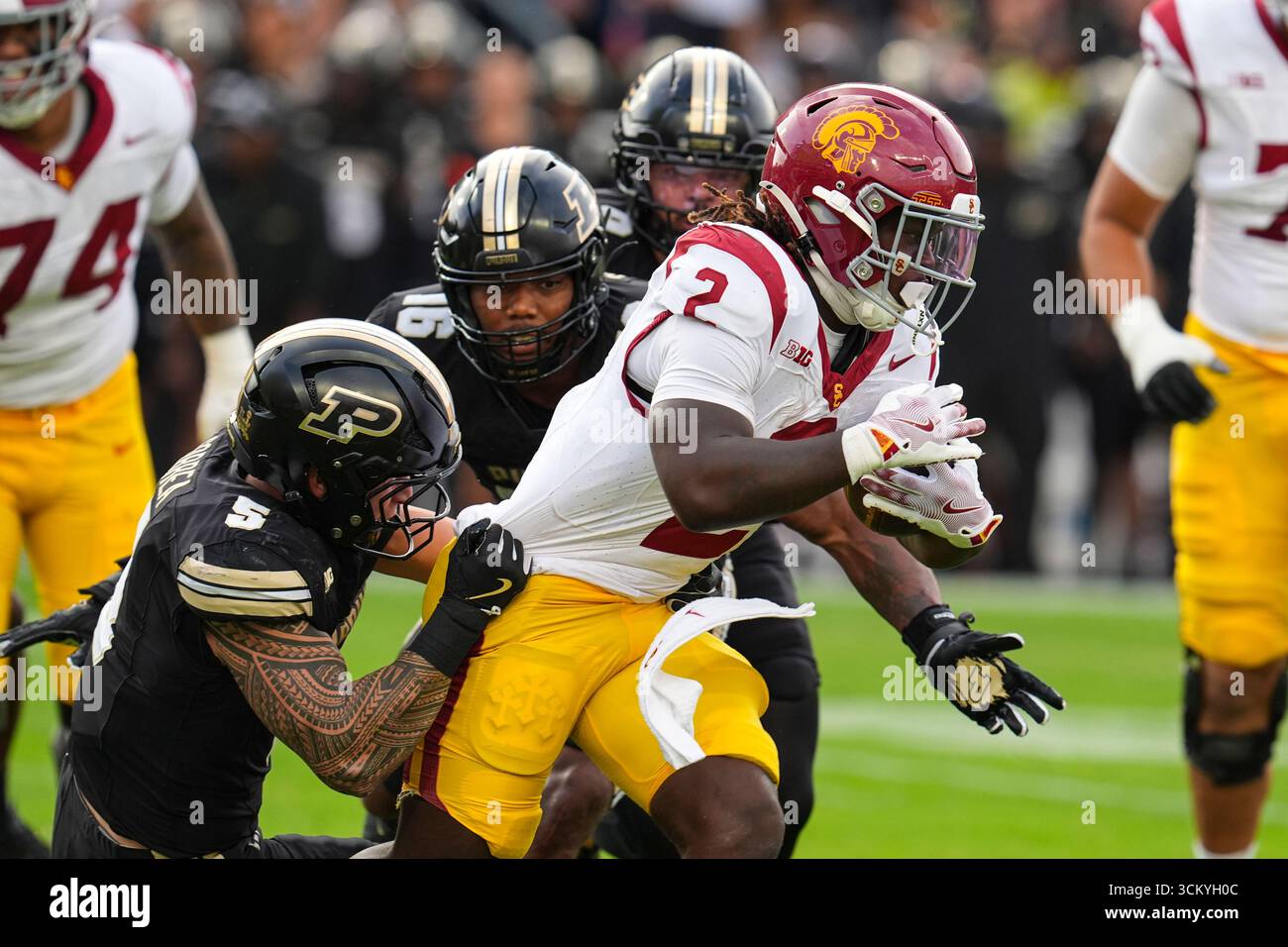 Southern California running back Waymond Jordan (2) is tackled by ...