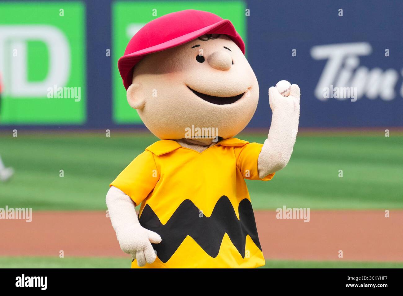 A mascot dressed as the cartoon character 'Charlie Brown' throws the ...