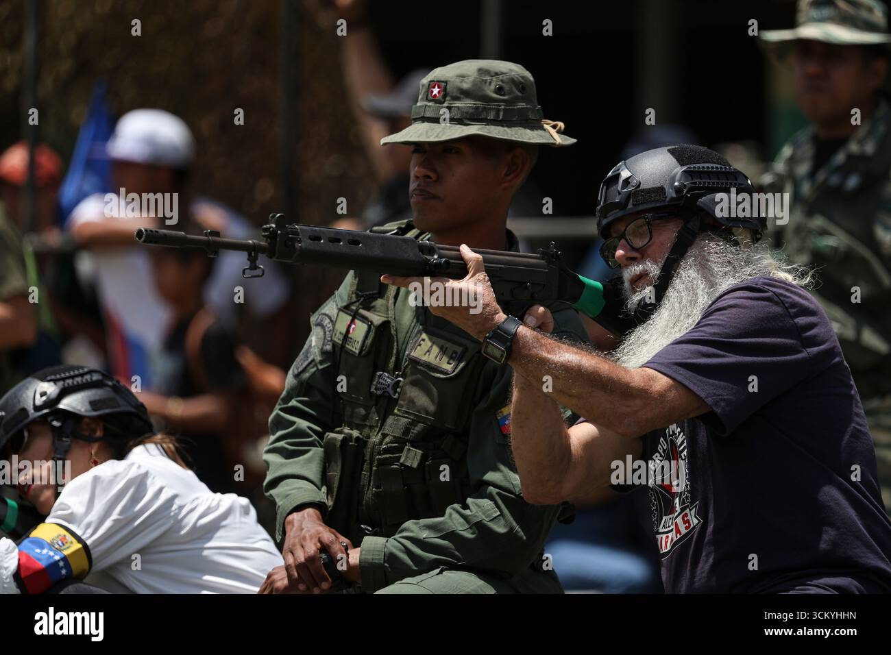 Members of the government-organized militias receive military training ...