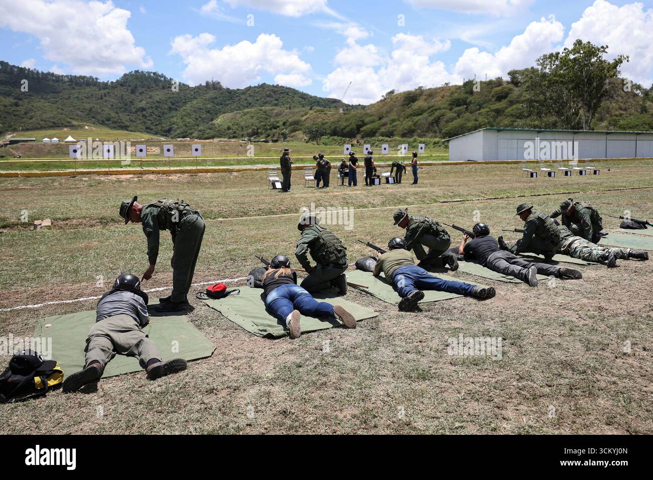 Members of the government-organized militias receive military training ...