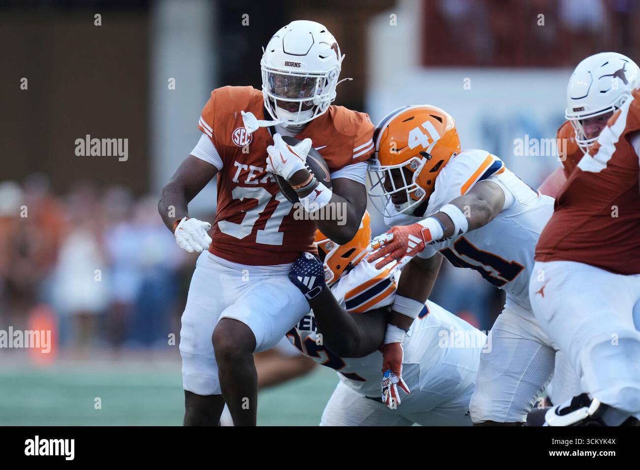 Texas running back James Simon (31) runs past UTEP linebacker Vashon ...