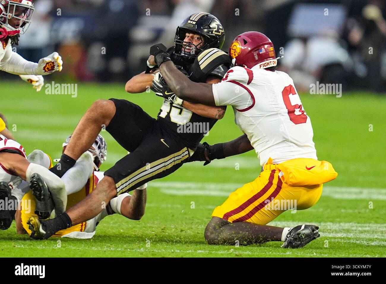 Purdue running back Devin Mockobee (45) is tackled after a catch by ...