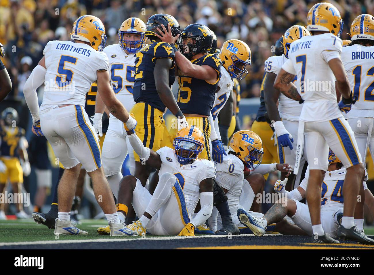 West Virginia running back Tye Edwards (2) and quarterback Scotty Fox ...