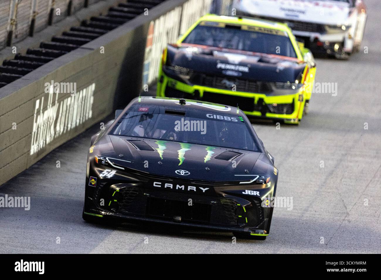 Ty Gibbs (54) leads Ryan Blaney (12) during a NASCAR Cup Series auto ...