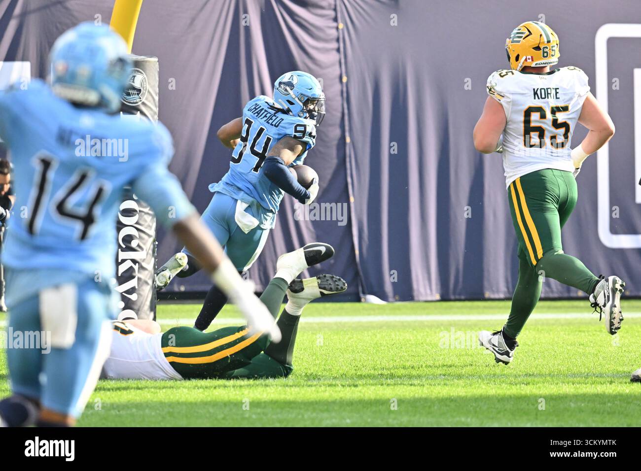 Toronto Argonauts defensive lineman Andrew Chatfield (94) scores a ...