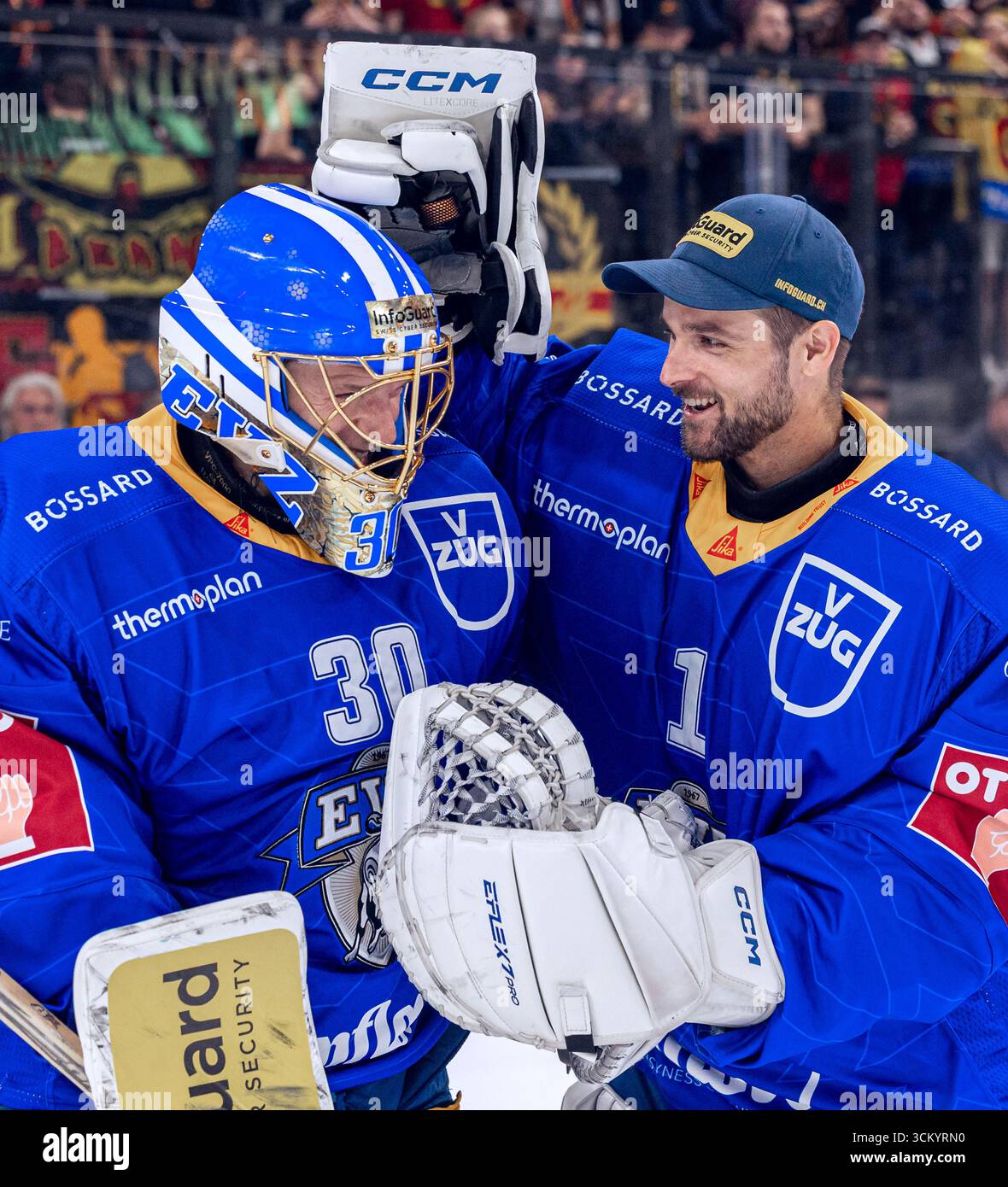 Goalkeeper Leonardo Genoni #30 (EV Zug) and goalkeeper Tim Wolf #1 (EV ...