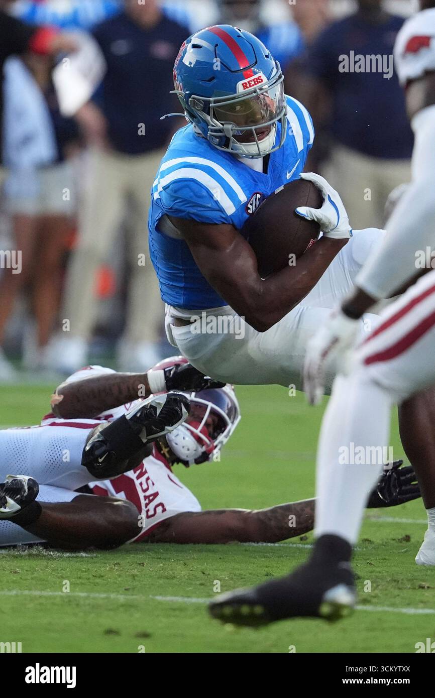 Mississippi running back Kewan Lacy (5) spins out of a tackle attempt ...