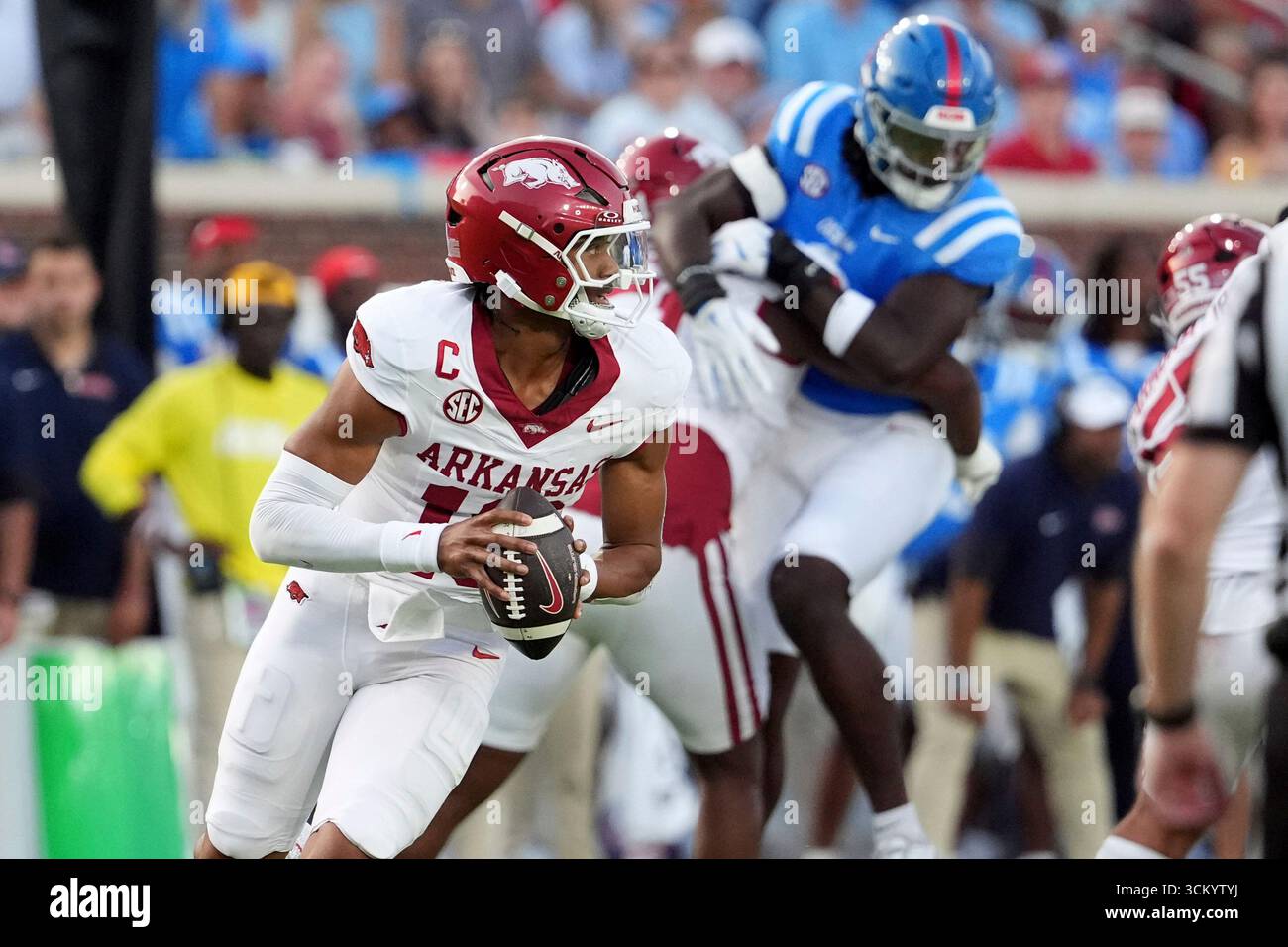 Arkansas quarterback Taylen Green (10) looks for a pass while pursued ...