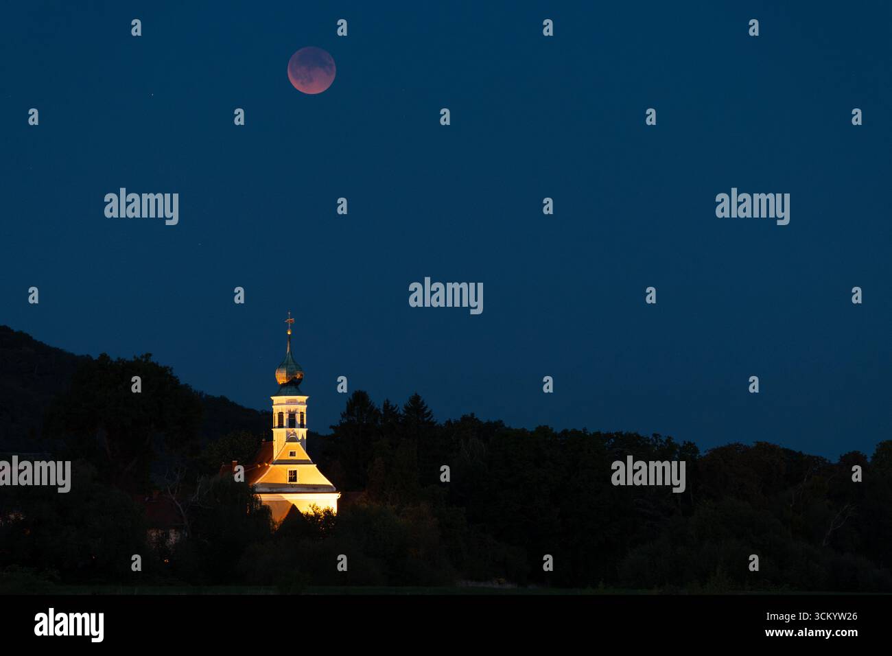 Total lunar eclipse in Dresden, Germany. The dark and red glowing moon ...