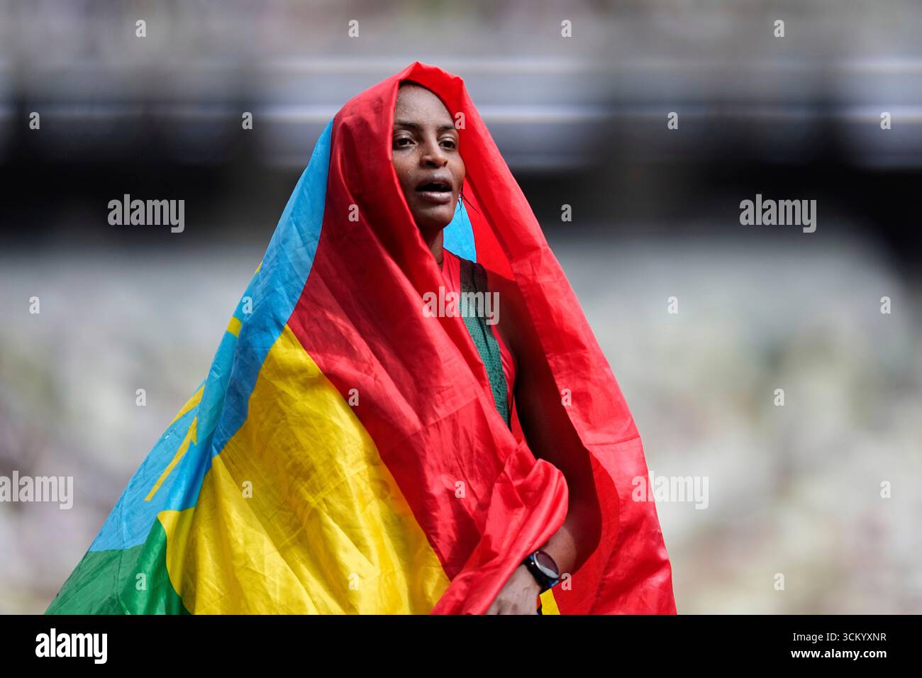 Ethiopia's Tigst Assefa, silver, reacts after the women's marathon at ...
