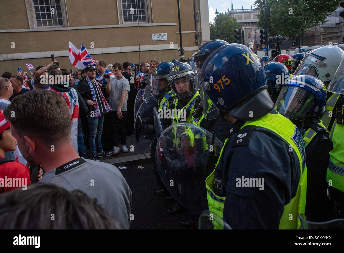 The riot police line up to push the protesters out from the street near ...
