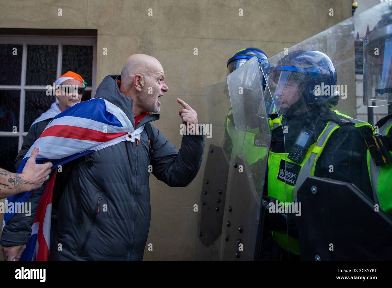 Metropolitan Police riot officers clash with a protestor during a ...