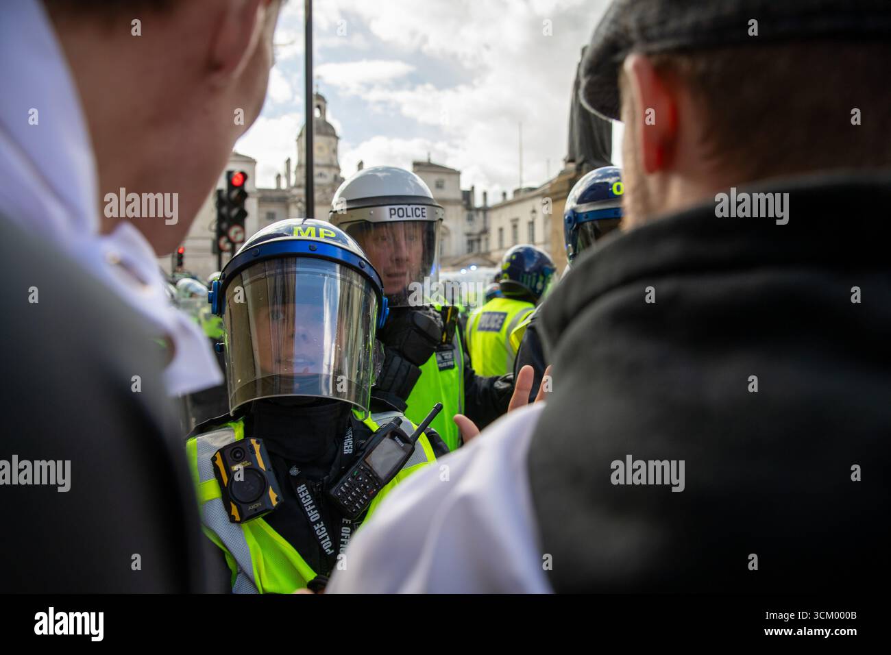 Metropolitan Police riot officers clash with protestors at a ...