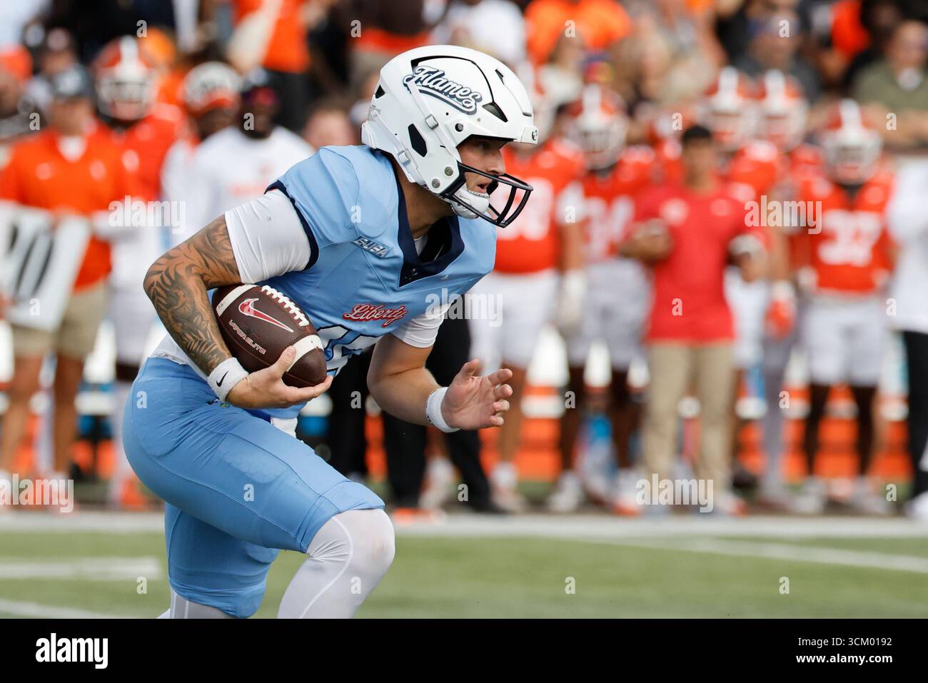 Liberty Flames quarterback Ethan Vasko (15) rushes against the Bowling ...