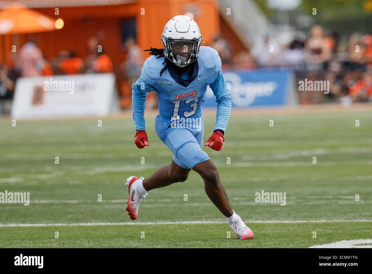 Liberty Flames cornerback Damond Harmon (13) pursues a play on defense ...