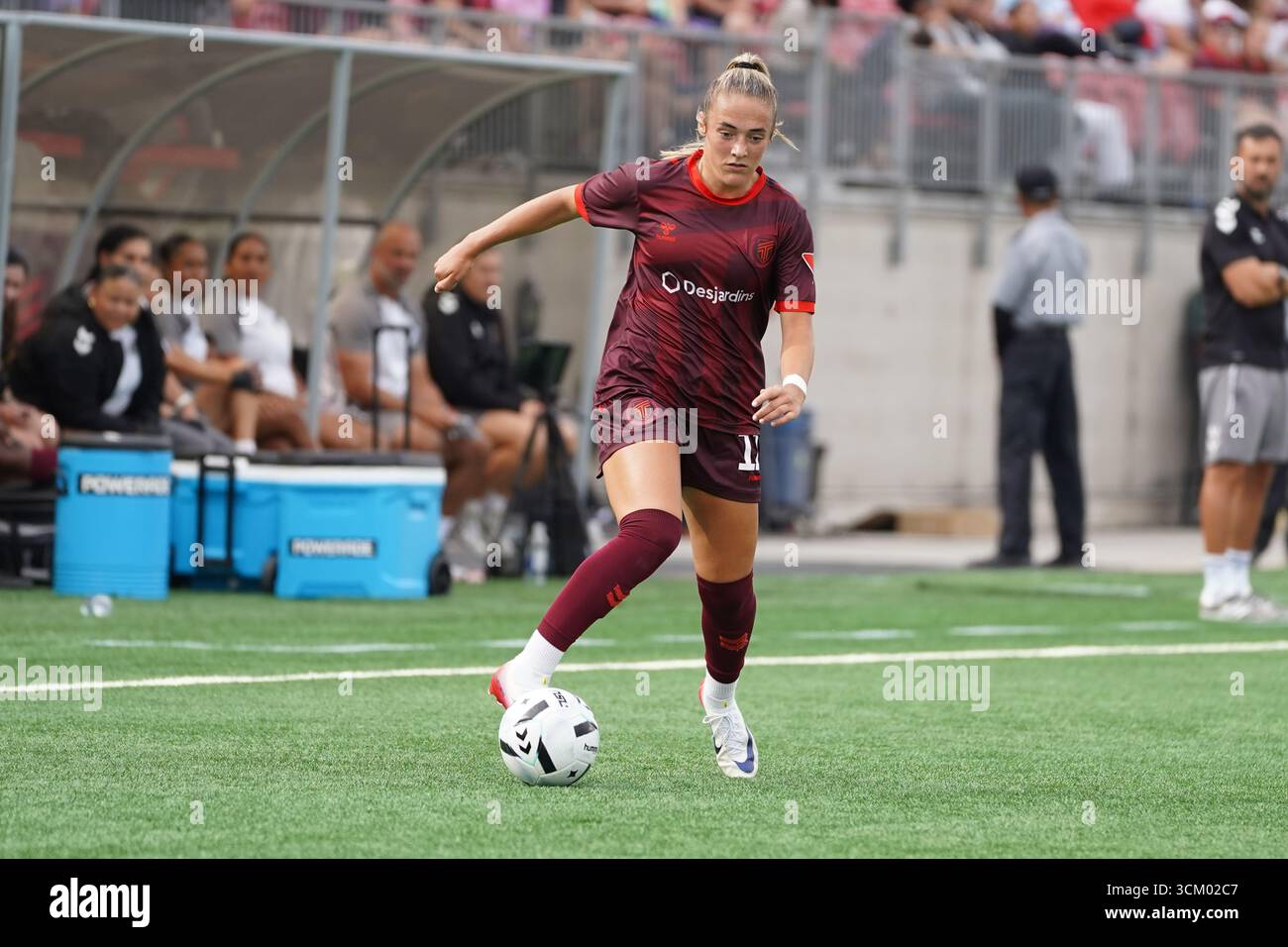 Kaylee Hunter #11 of AFC Toronto drives the ball forward during the ...