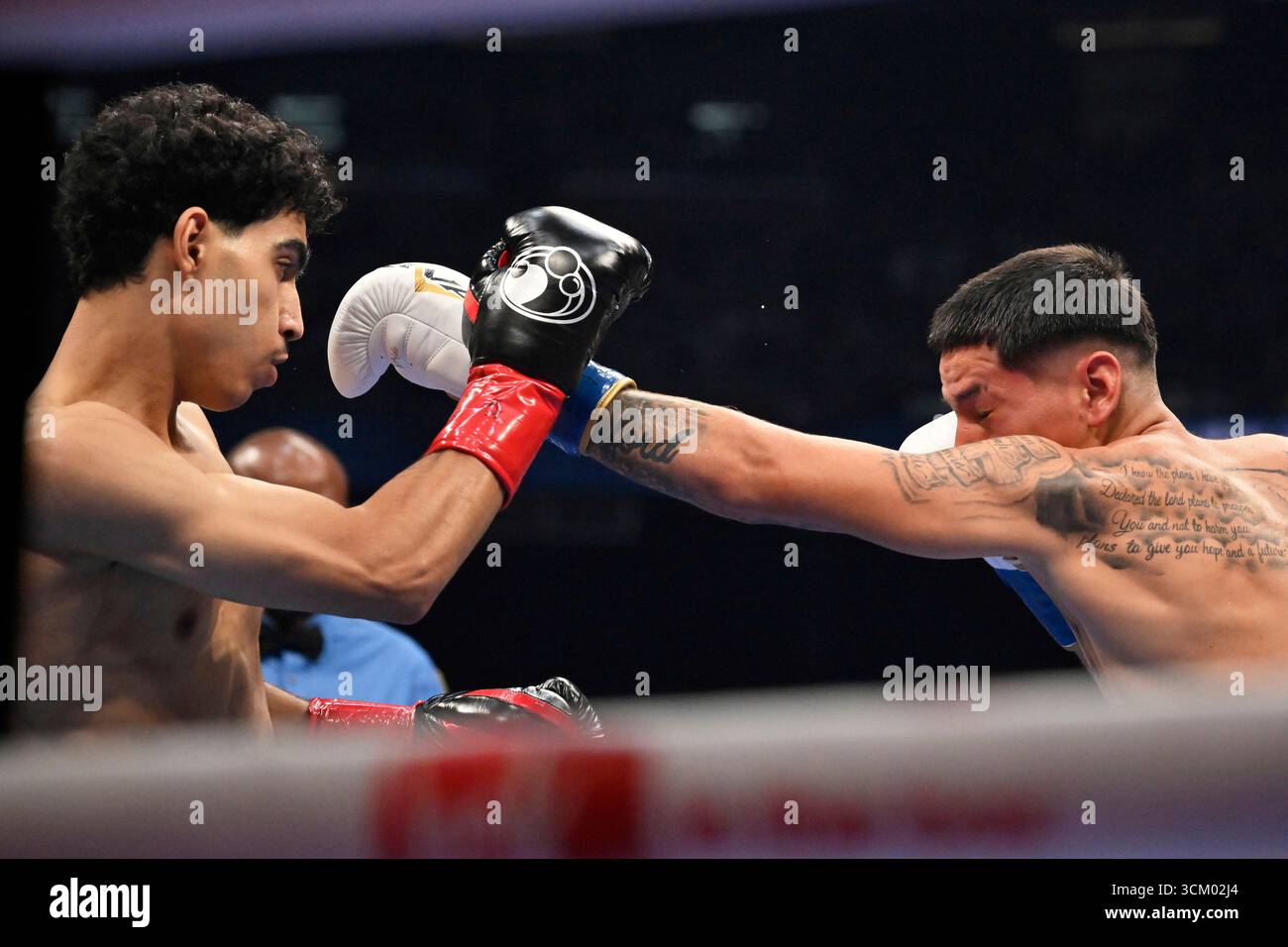 Travis Crawford, right, throws a punch at Mohammed Alakel during a ...