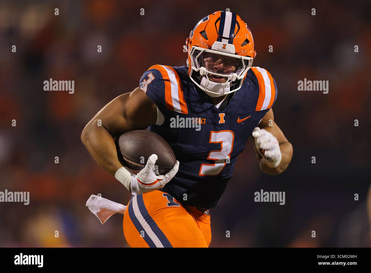 Illinois Kaden Feagin (3) runs with the ball during an NCAA football ...
