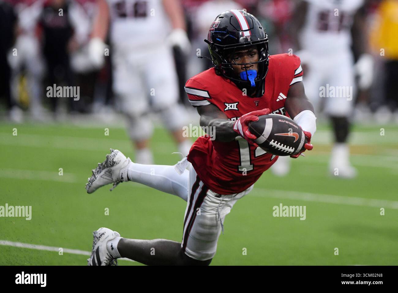 Texas Tech defensive back Brice Pollock (14) intercepts the ball during ...