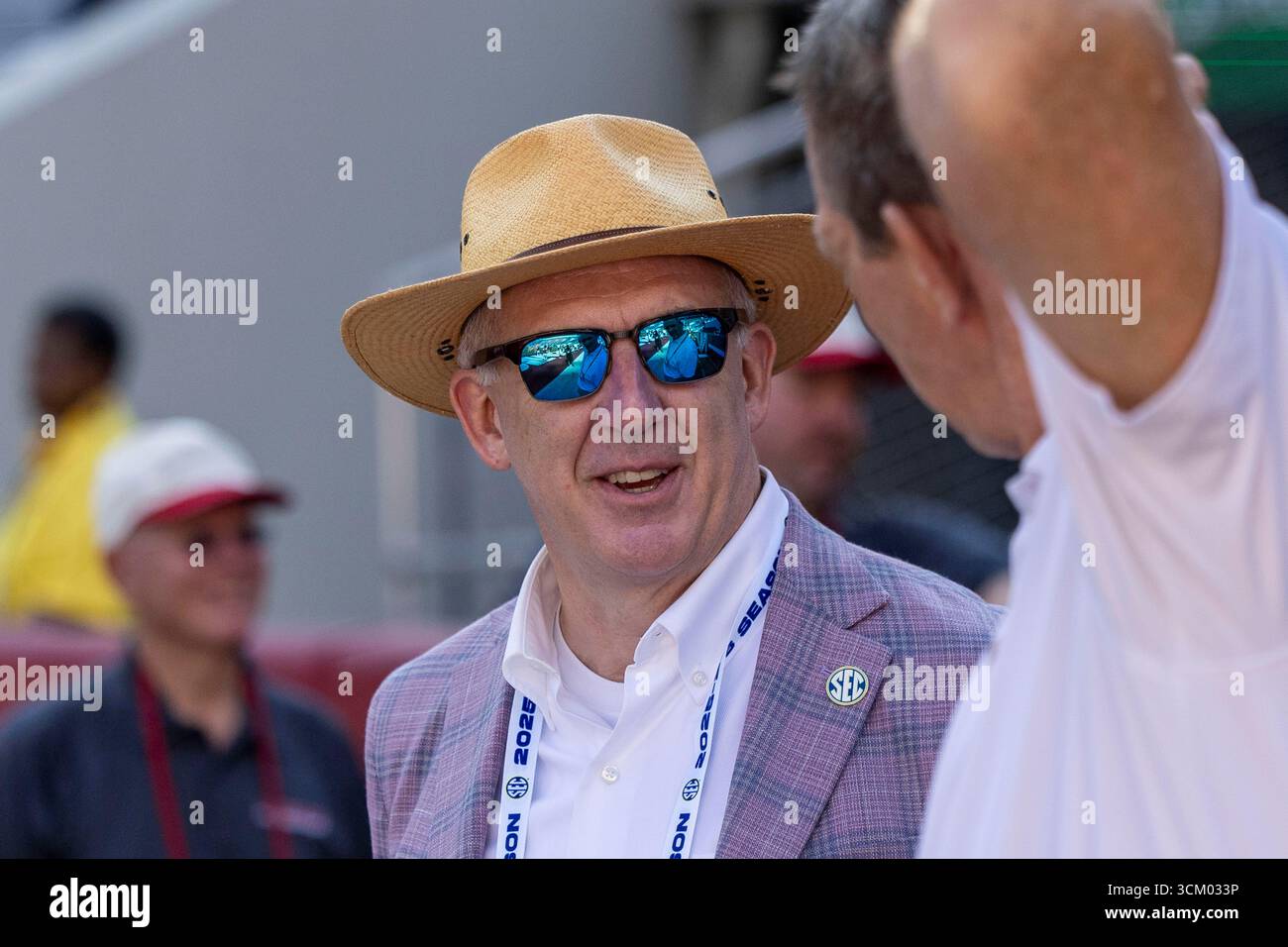 Southeastern Conference commissioner Greg Sankey visits the field ...