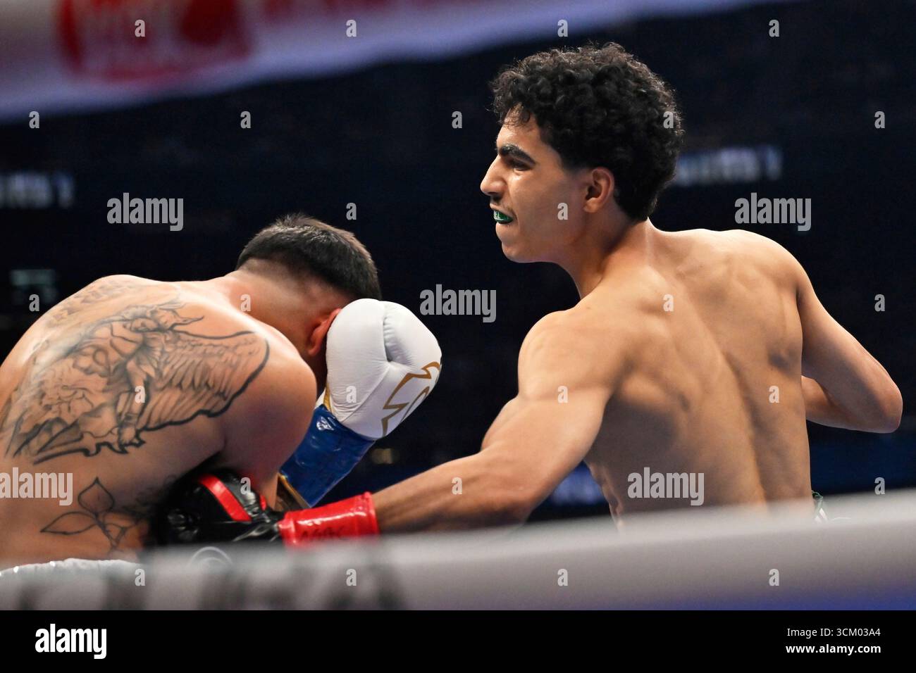 Mohammed Alakel, right, punches Travis Crawford during a lightweight ...