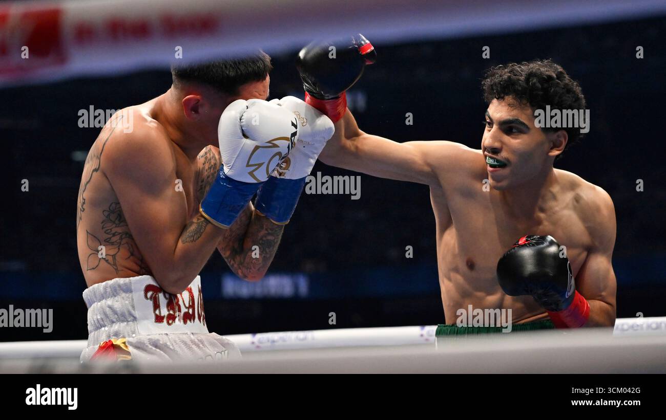 Mohammed Alakel, right, punches Travis Crawford during a lightweight ...
