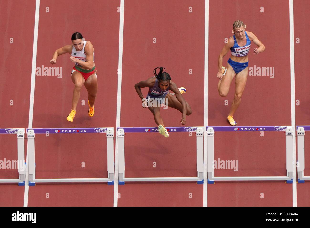 United States' Masai Russell, center, competes in a women's 100 meters ...