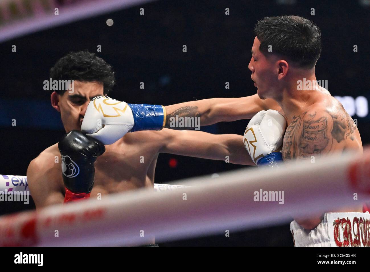 Travis Crawford, right, punches Mohammed Alakel during a lightweight ...