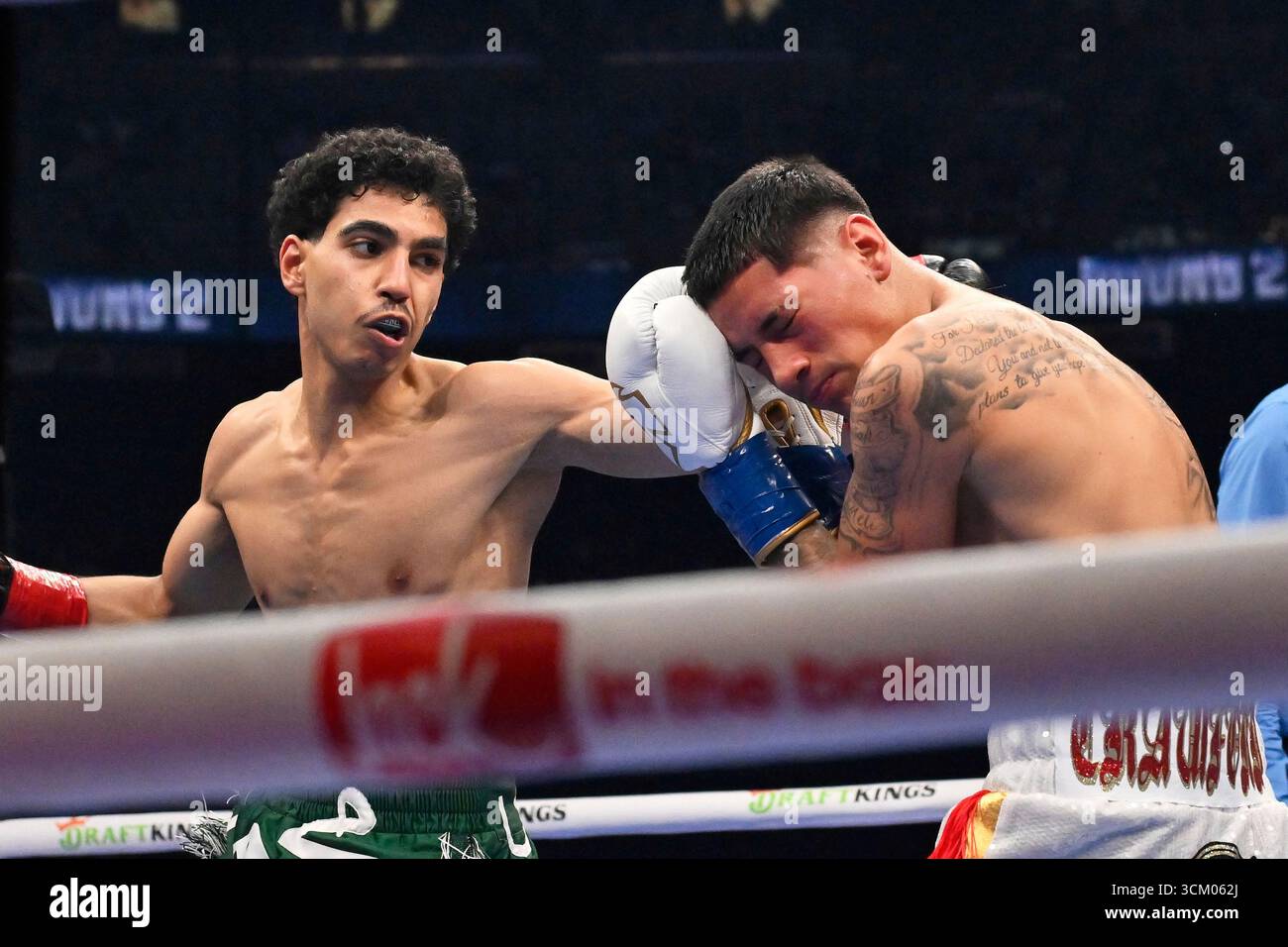 Mohammed Alakel, left, punches Travis Crawford during a lightweight ...
