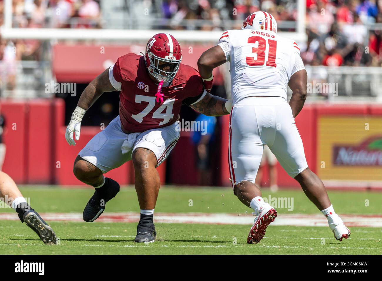Alabama offensive lineman Kadyn Proctor (74) blocks against Wisconsin ...