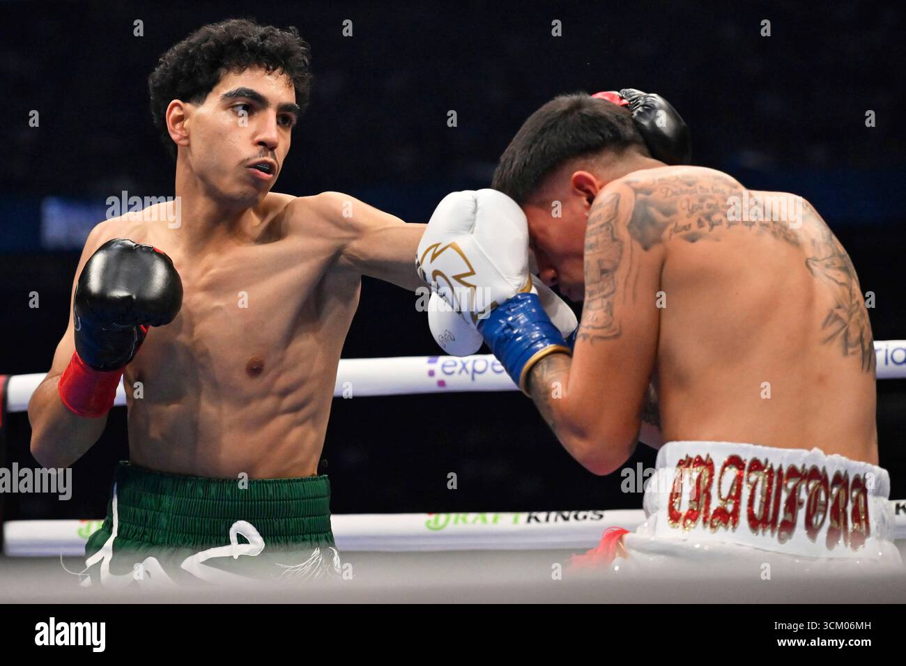 Mohammed Alakel, left, punches Travis Crawford during a lightweight ...