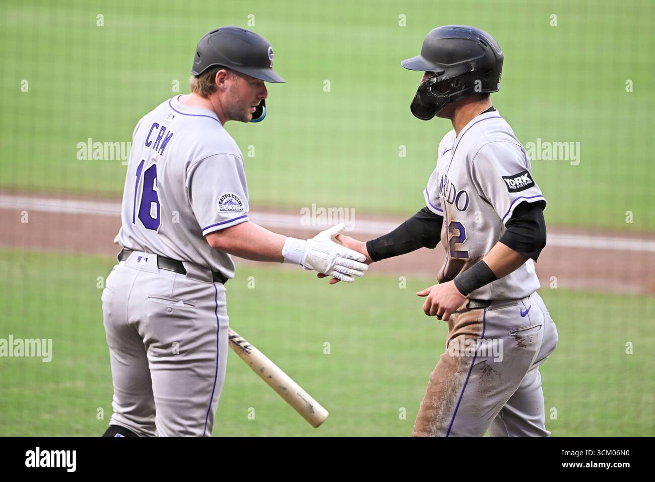 Colorado Rockies' Tyler Freeman (2) is congratulated by Blaine Crim (16 ...