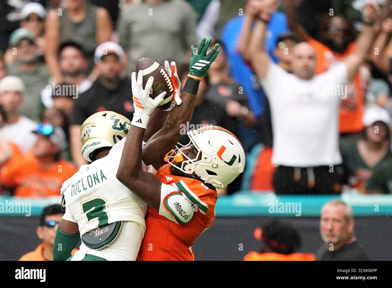 Miami wide receiver Joshua Moore, right, catches a pass to score a ...
