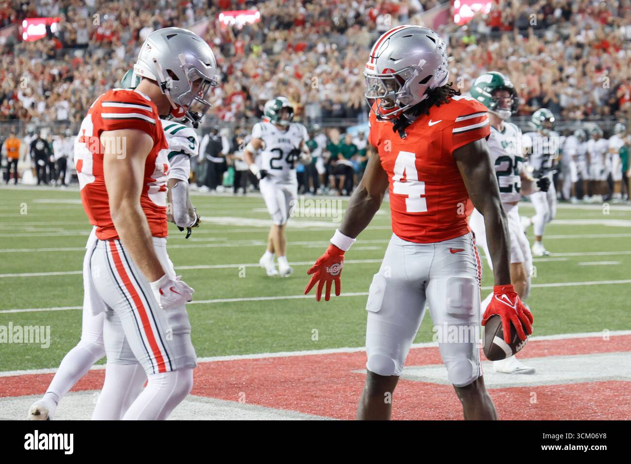 Ohio State receiver Jeremiah Smith, right, celebrates his touchdown ...