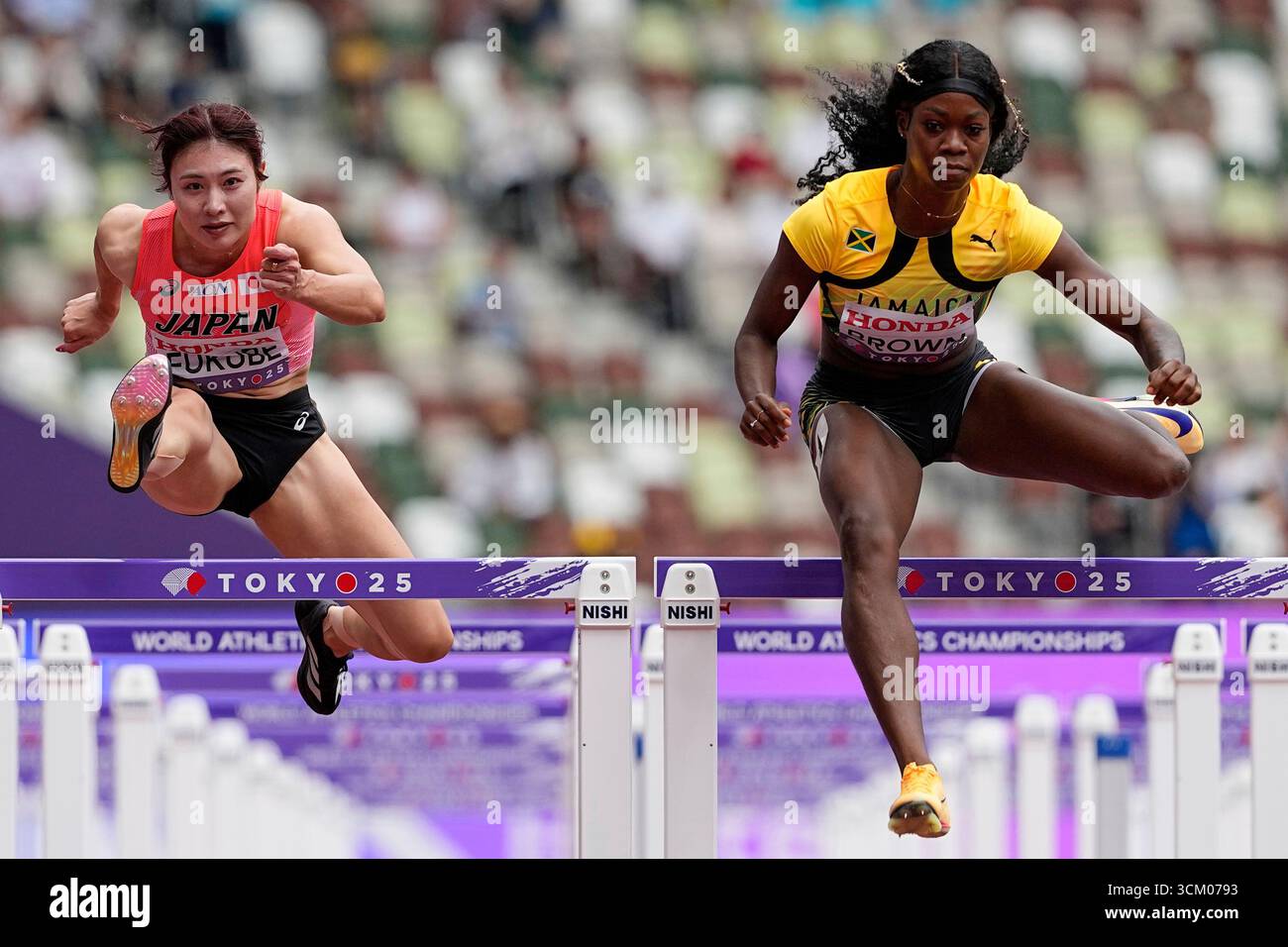 Japan's Mako Fukube and Jamaica's Amoi Brown compete in a women's 100 ...