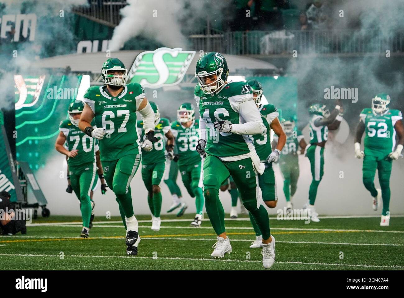 The Saskatchewan Roughriders are introduced before CFL football action ...