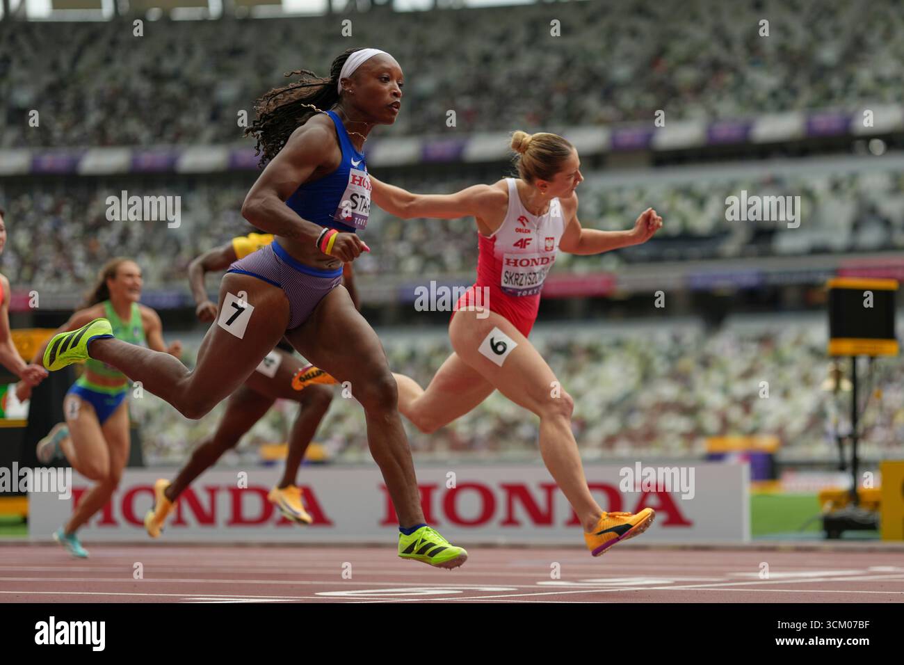 United States' Grace Stark (7) competes in a women's 100 meters hurdles ...