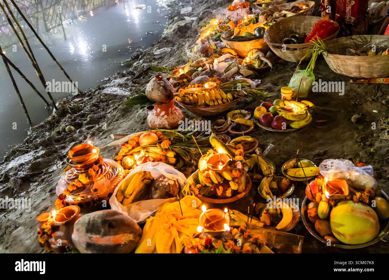 sacred chhath puja daali with offering fruits lit with traditional oil ...