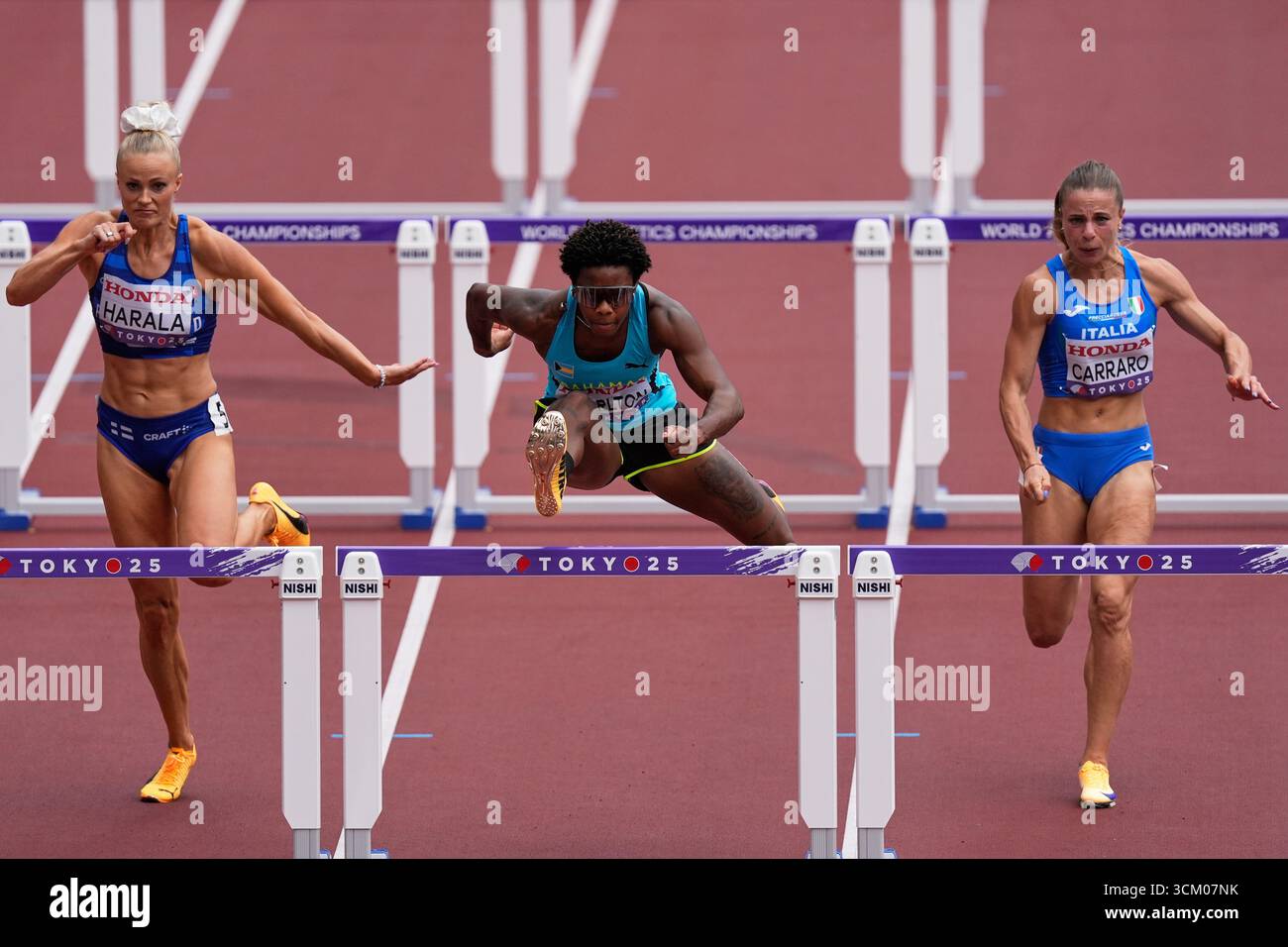 Bahamas' Devynne Charlton, centre, leads Finland's Lotta Harala, left ...