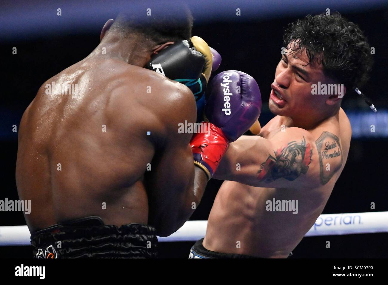 Lester Martinez, right, punches Christian Mbilli during a WBC super middleweight interim world ...