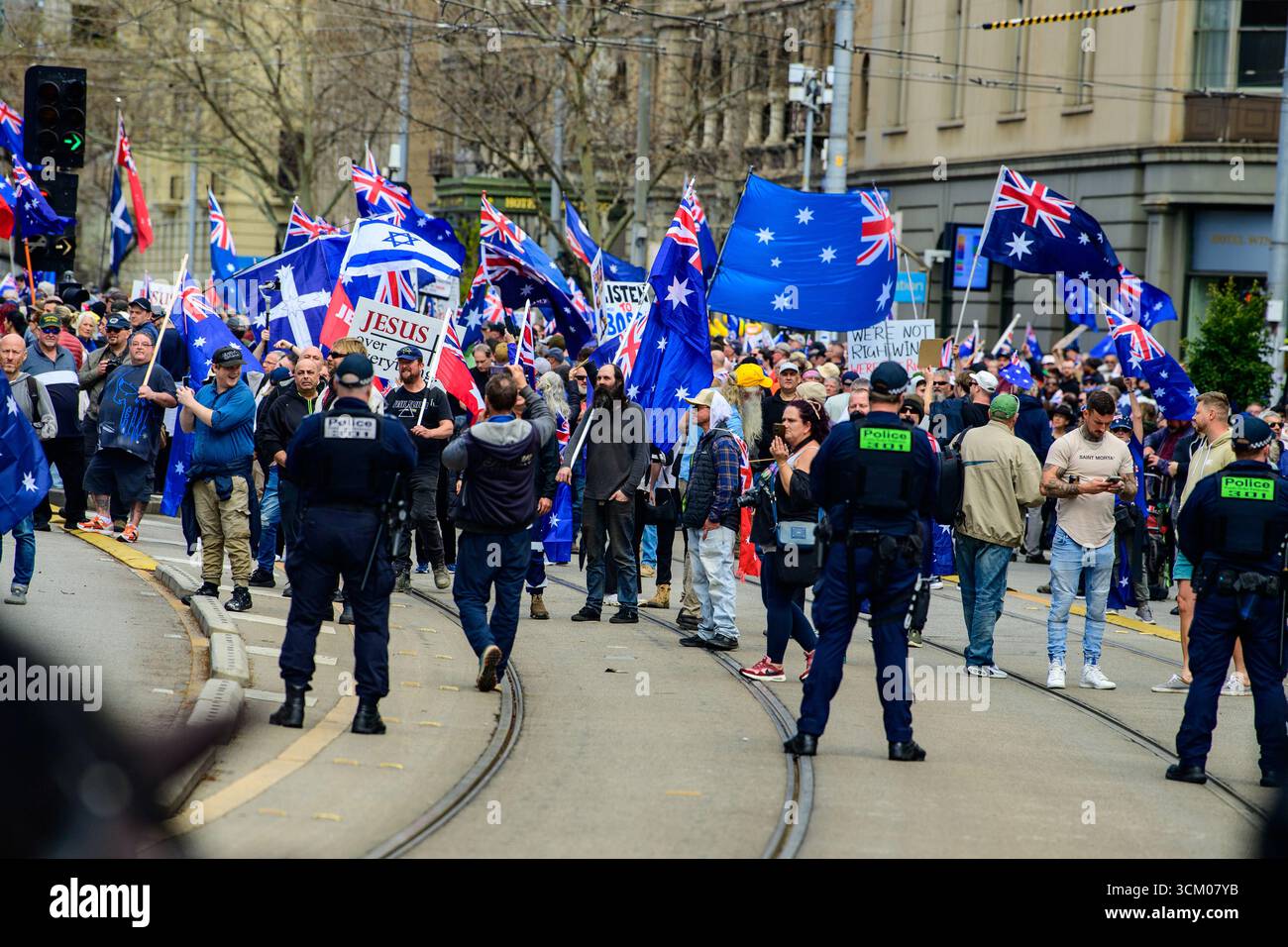 Anti-immigration nationalist protesters wave Australian flags outside ...