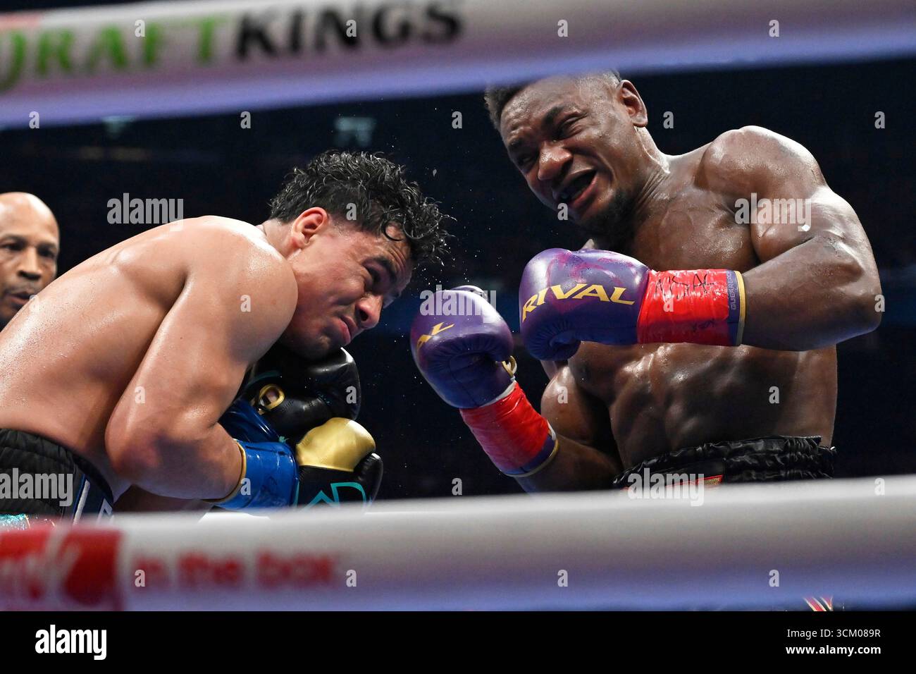 Lester Martinez, left, fights Christian Mbilli during a WBC super ...