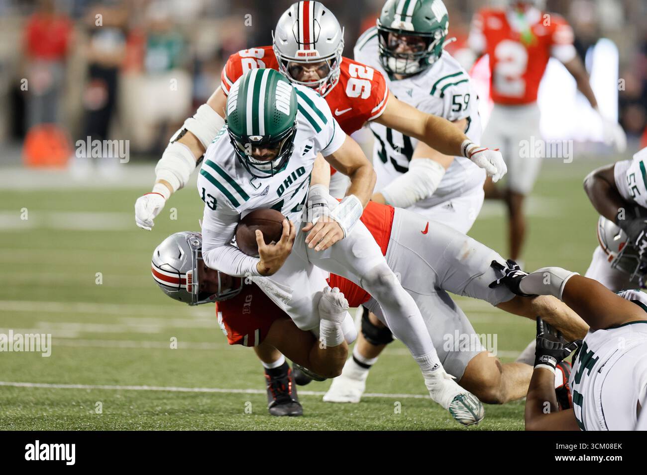 Ohio State defensive lineman Caden Curry (92) and defensive lineman ...