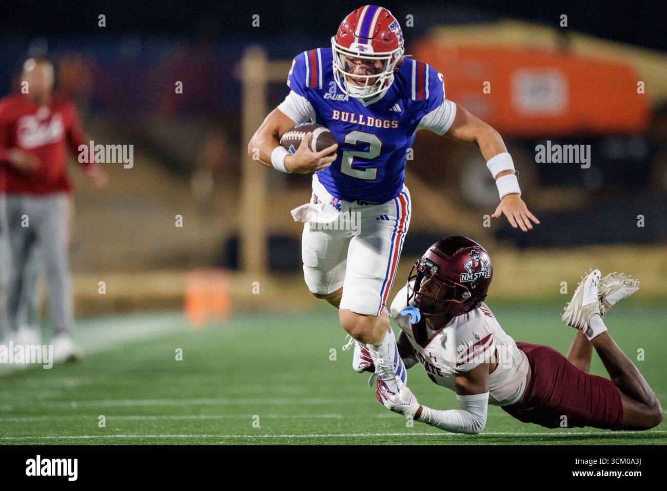 New Mexico State safety Naeten Mitchell (4) tackles Louisiana Tech ...