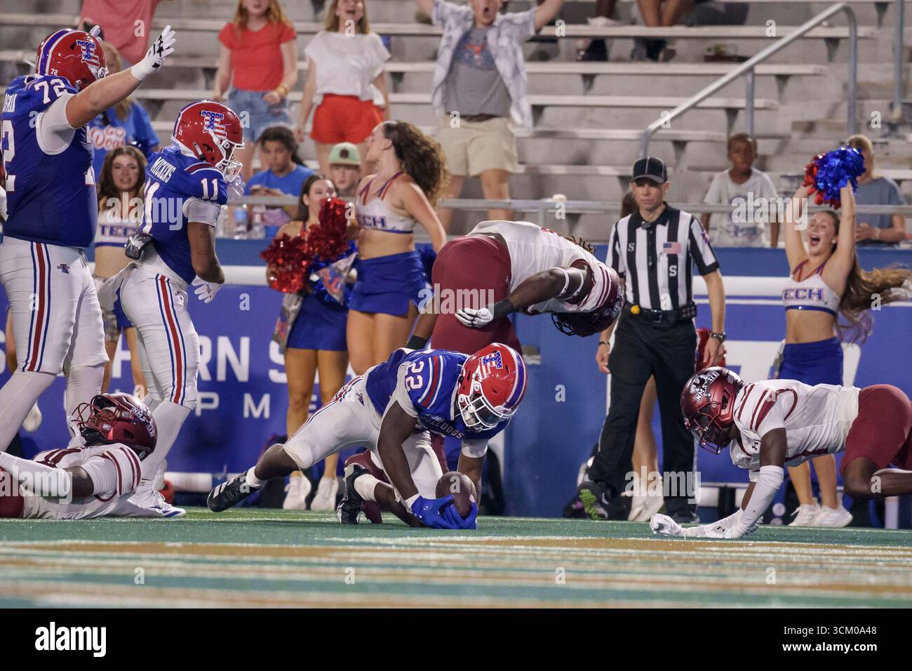 Louisiana Tech running back Omiri Wiggins (22) scores a touchdown ...