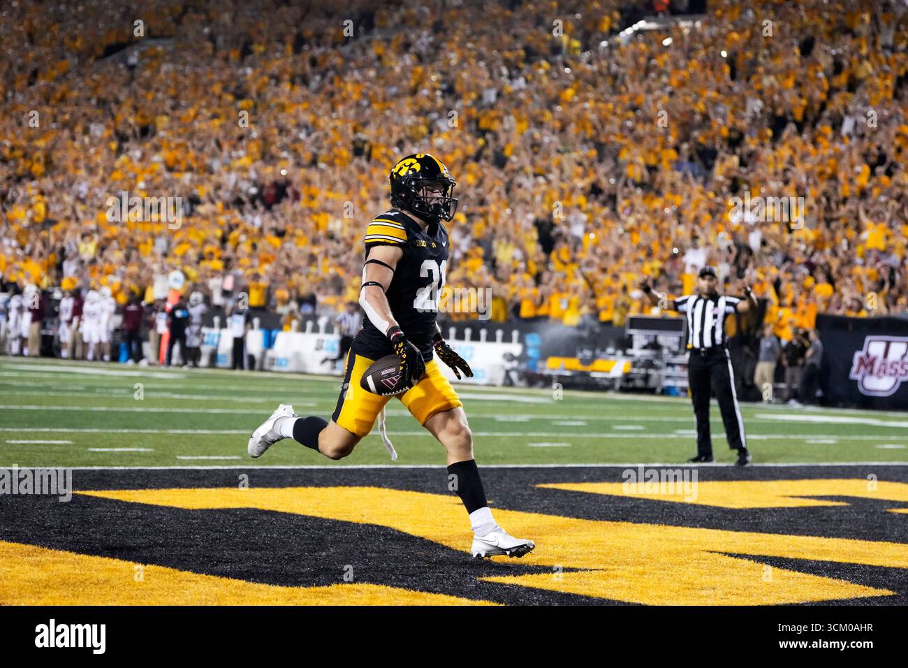 Iowa's Kaden Wetjen (21) celebrates as he returns a punt for a ...