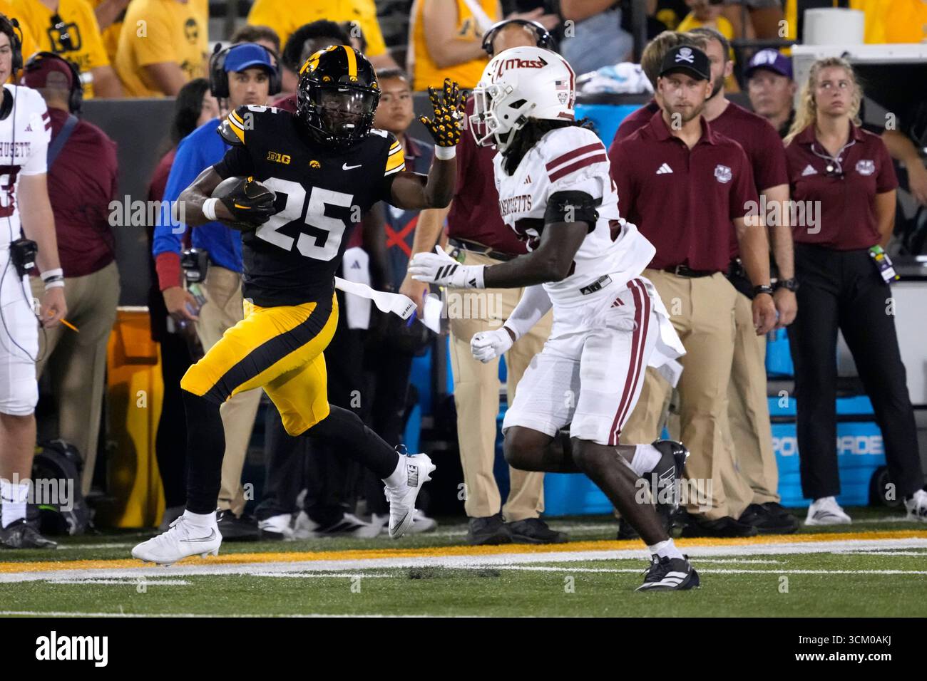 Iowa running back Nathan McNeil (25) runs from Massachusetts safety ...
