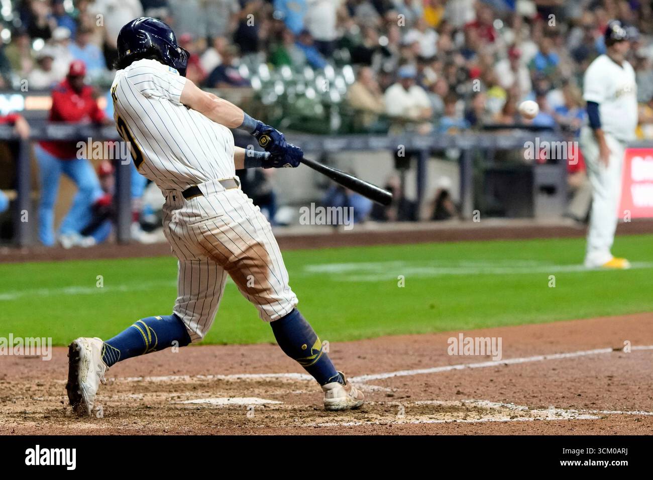 Milwaukee Brewers' Sal Frelick hits an RBI double during the ninth ...